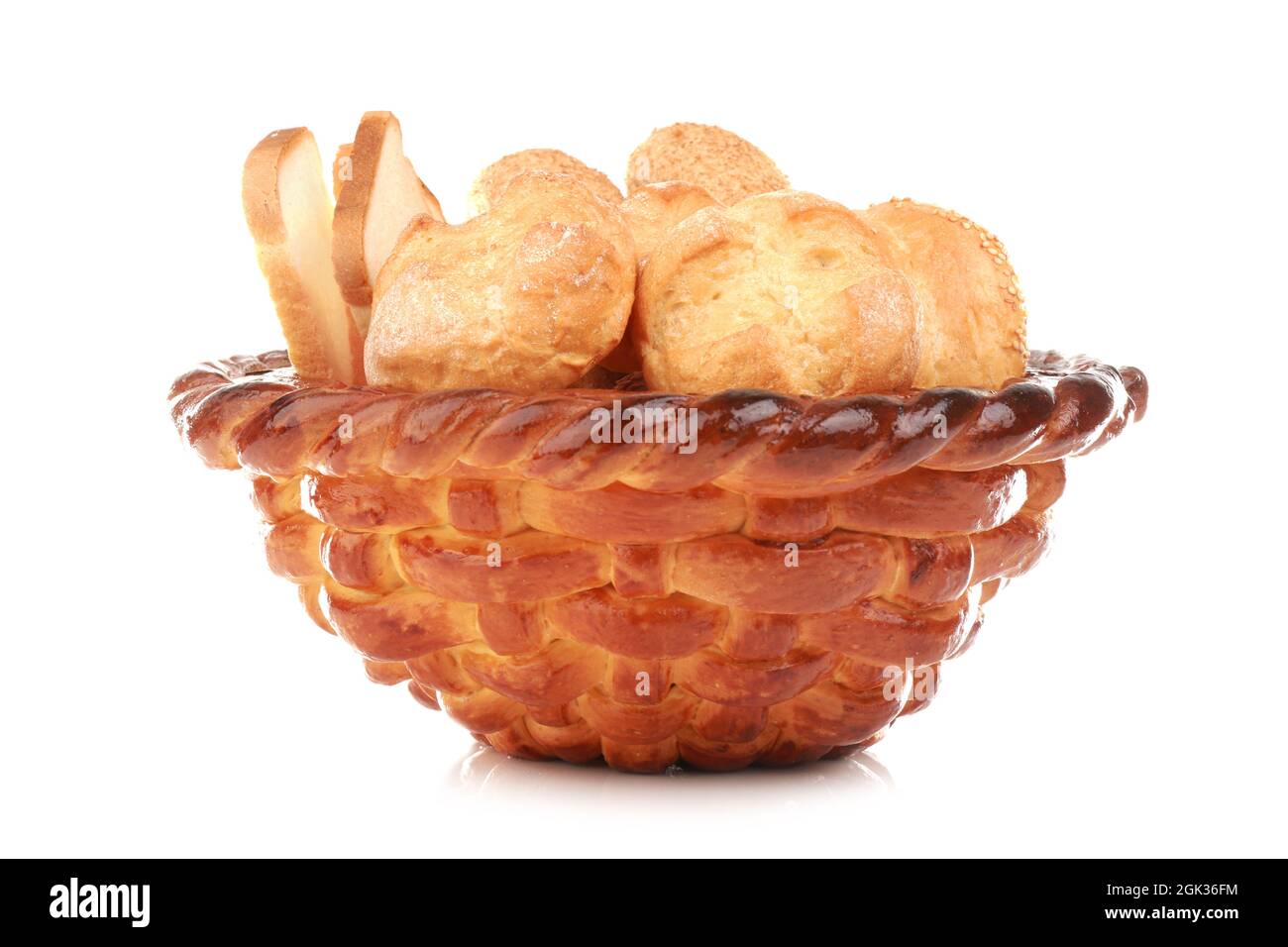 Braided bread basket with delicious buns on white background Stock ...