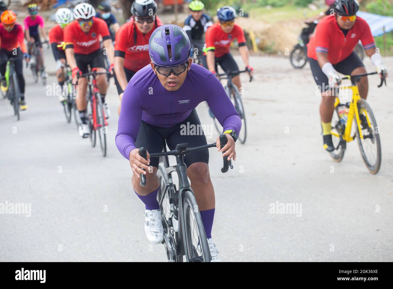 Cyclists are seen in action during the fun bike race. One of the ...