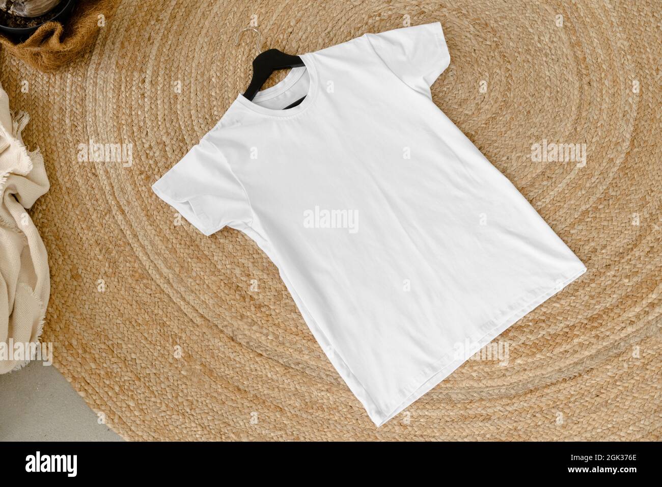 Plain white cotton t-shirt on hanger for your design Stock Photo - Alamy