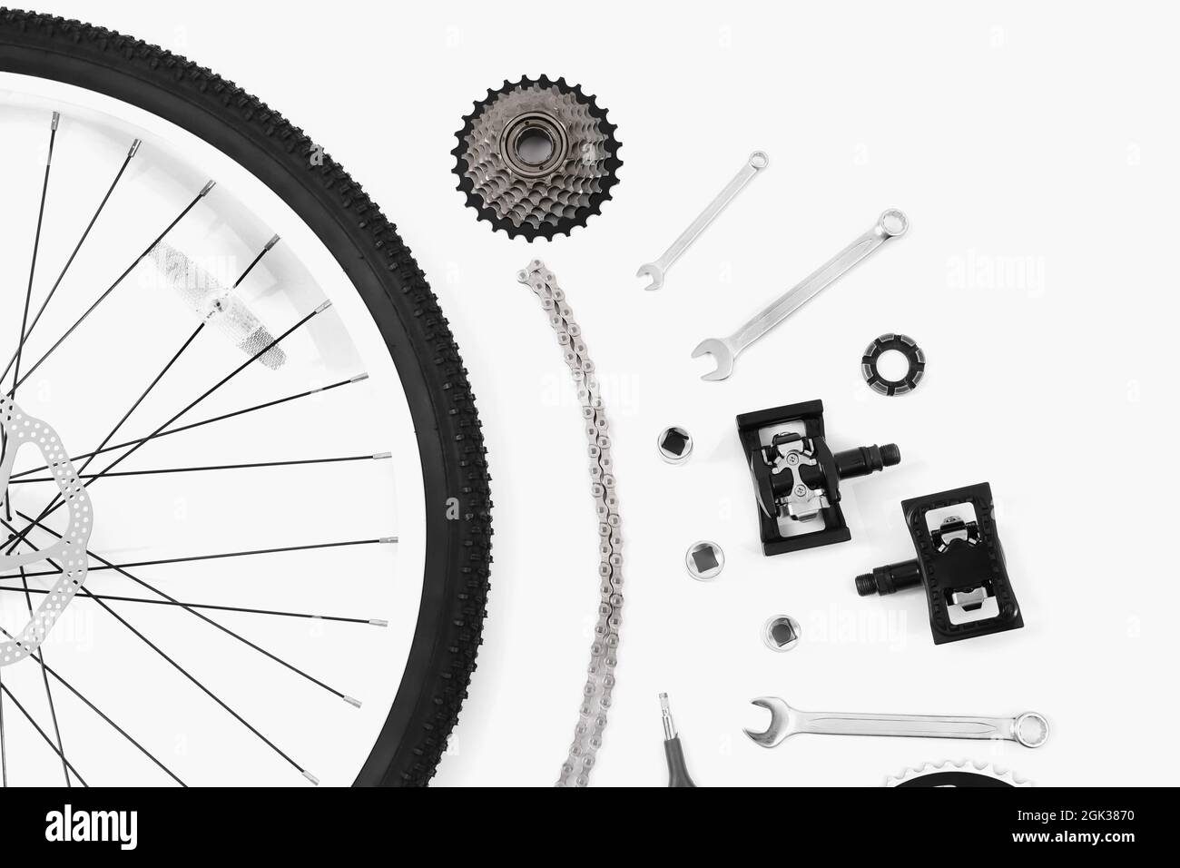 Bicycle parts and repair tools on white background Stock Photo - Alamy