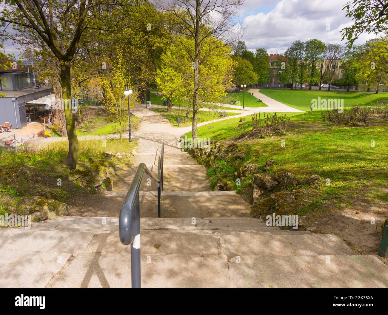Stone steps with steel handrail in a park Stock Photo - Alamy