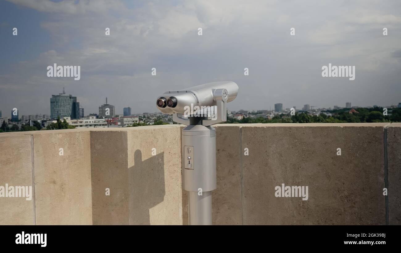 Close up of telescope on skyscraper rooftop used as observation point ...