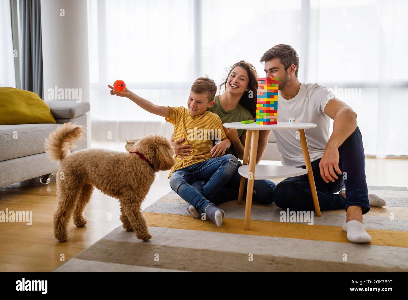 Happy young family having fun together at home. Happy childhood concept ...