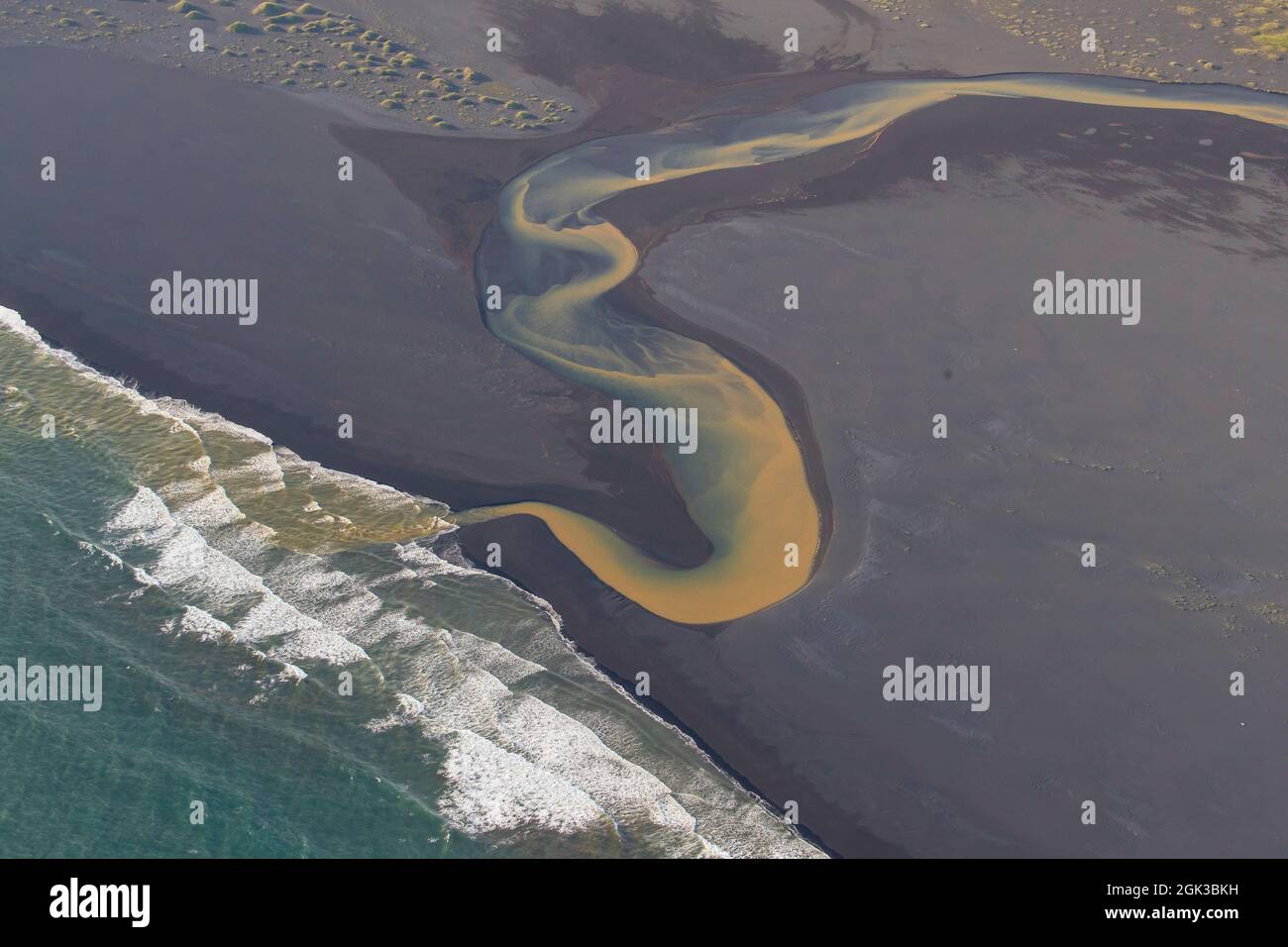 The sediment-rich Affall river flows into the sea at Landeyjarsandur ...