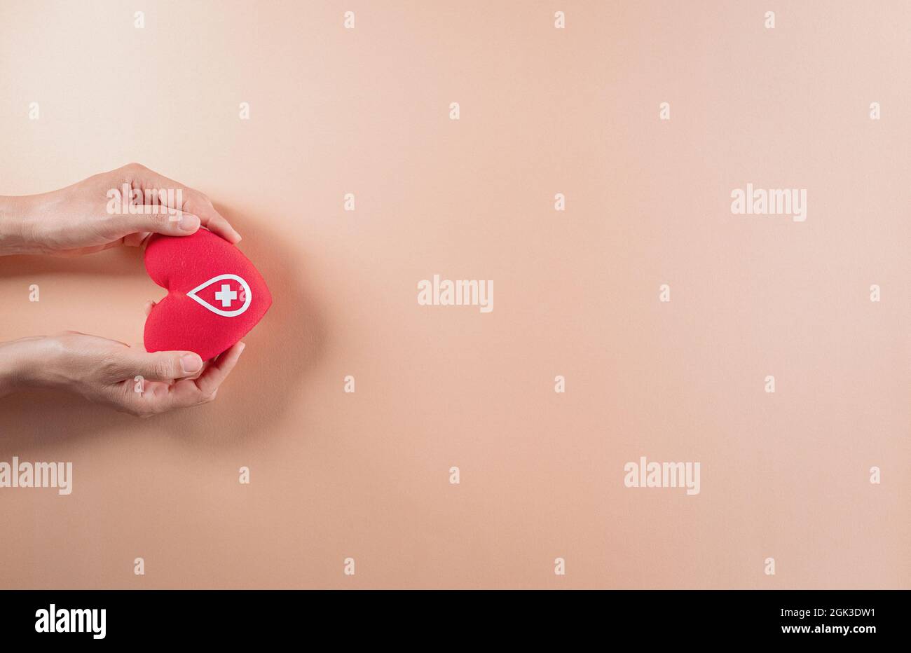 Medical and donor concepts. Hand holding a handmade red heart, a sign ...