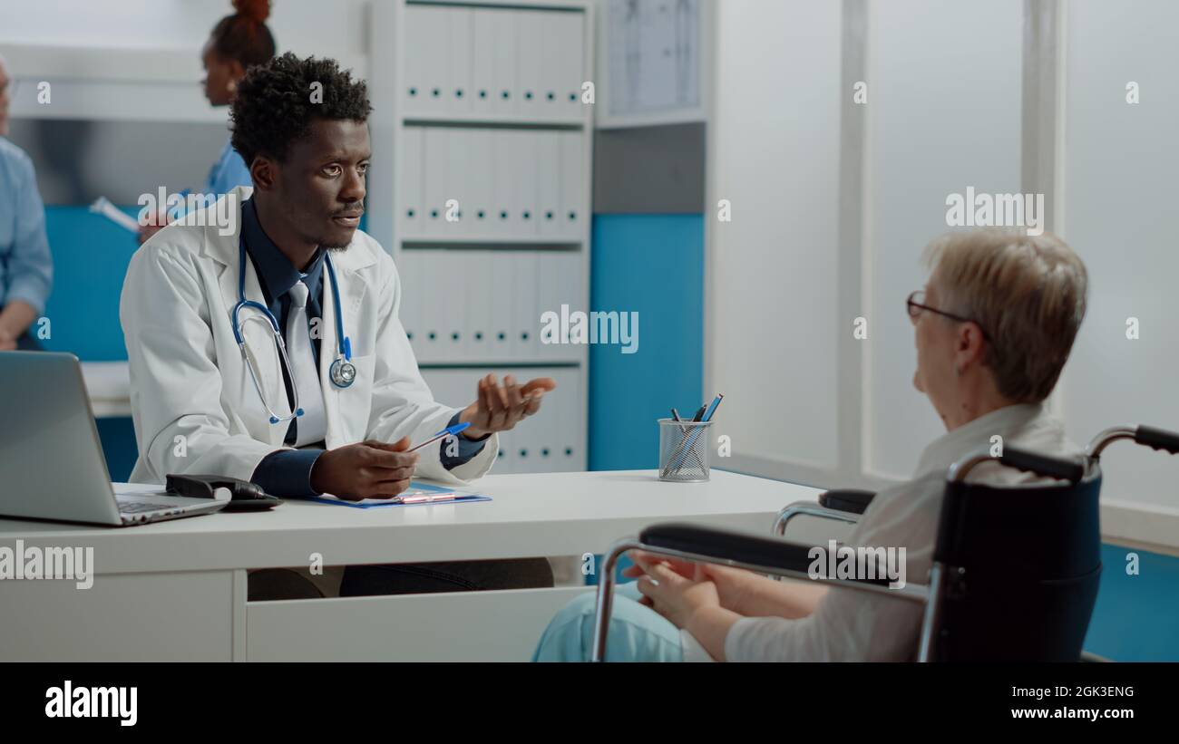 Invalid patient with disability having healthcare appointment with ...