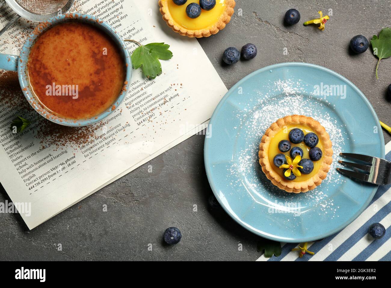 Delicious crispy tart with blueberries and custard cream on plate Stock ...