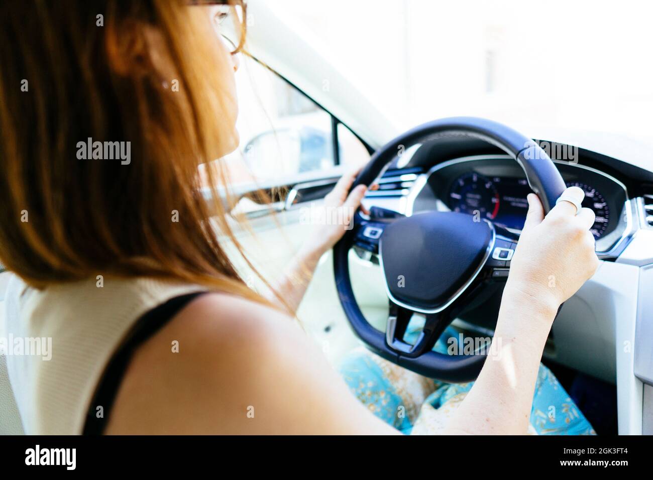 young adult woman driving a modern car Stock Photo - Alamy