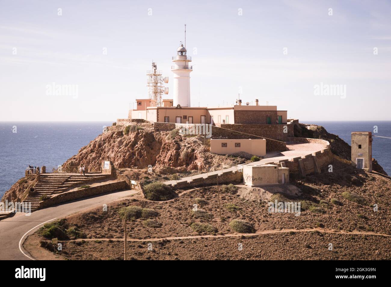 Scenic view of a curved road leading to the Malta Gozo Lighthouse in ...