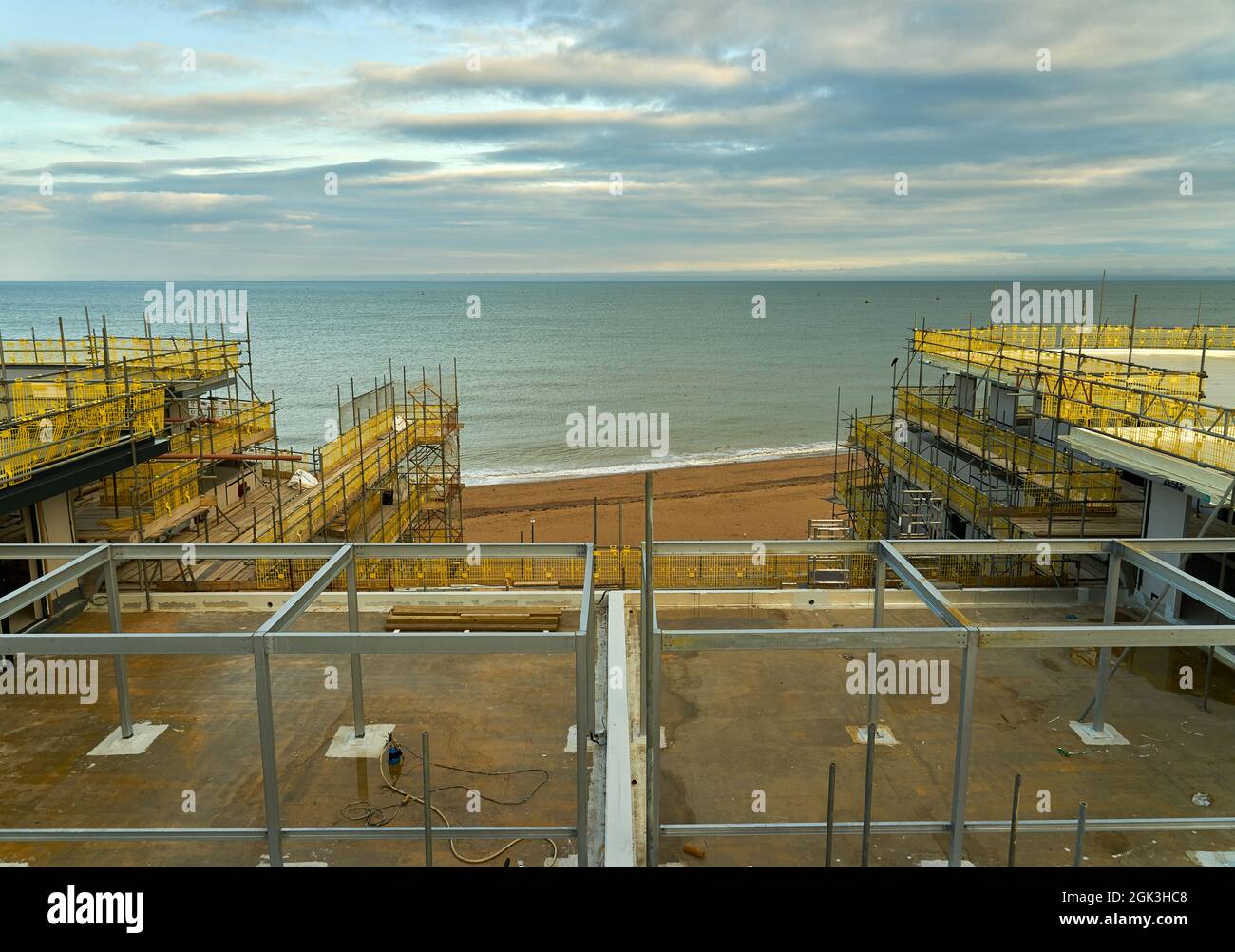 Construction site on the sandy beach with the view of the calm sea ...