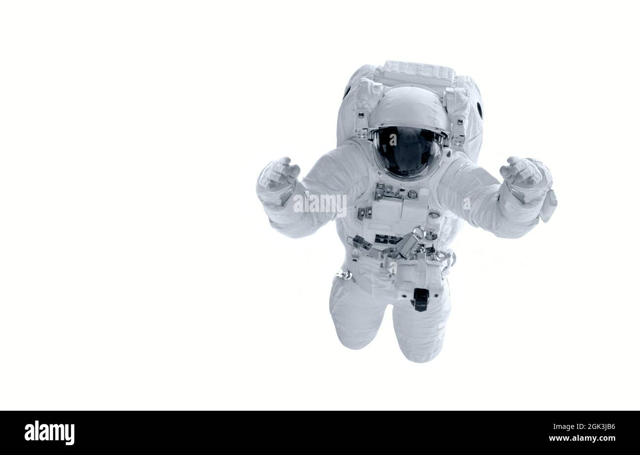 Astronaut in a spacesuit flies on a white background. Hands are raised ...