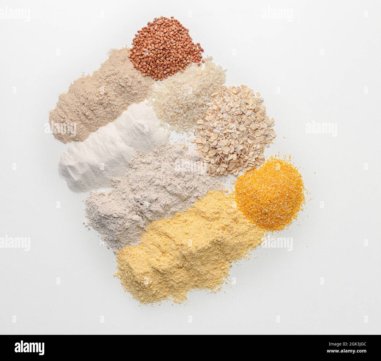 Different types of flour on white background Stock Photo - Alamy