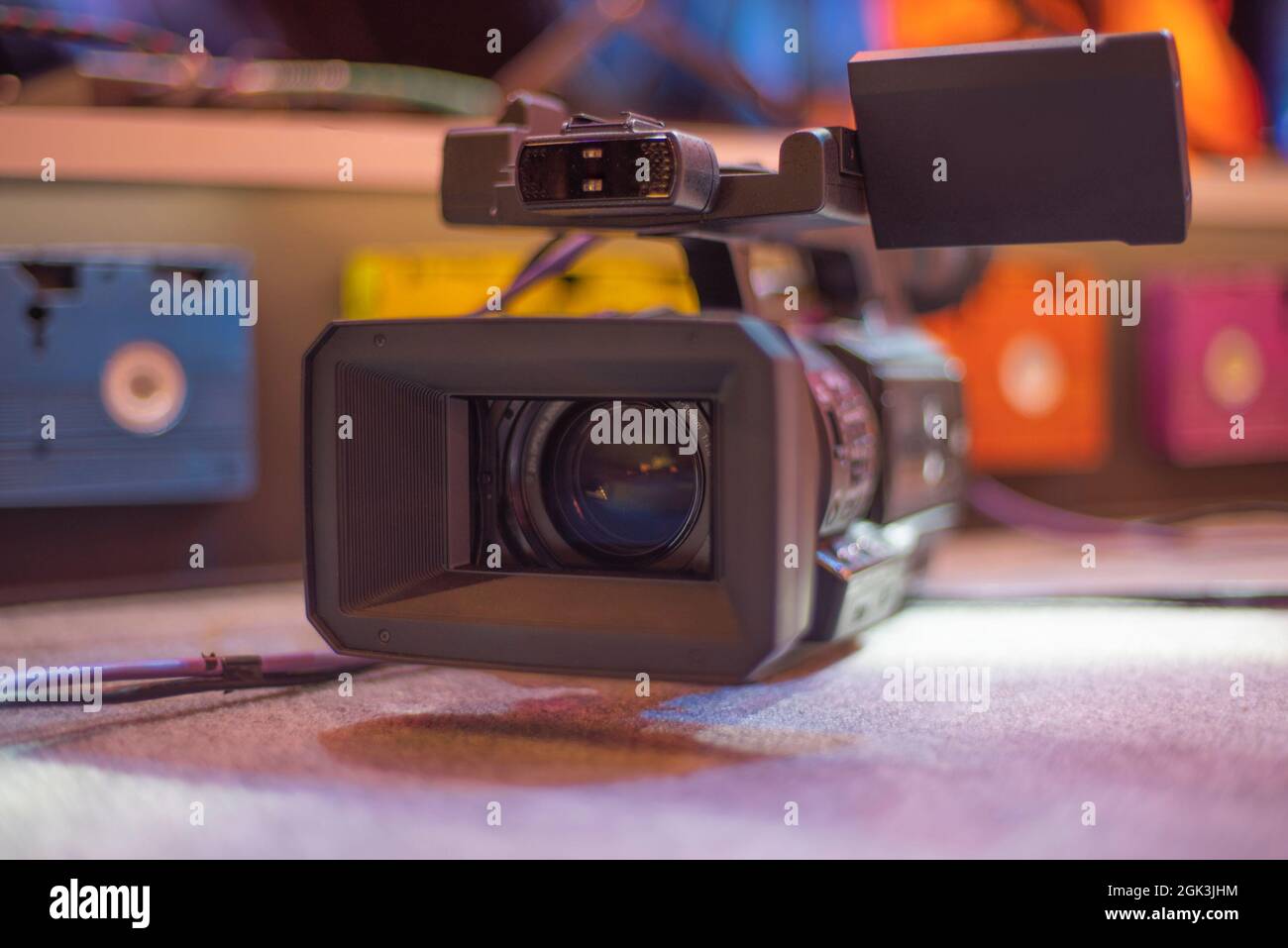 modern digital camera on vhs cassette background Stock Photo - Alamy