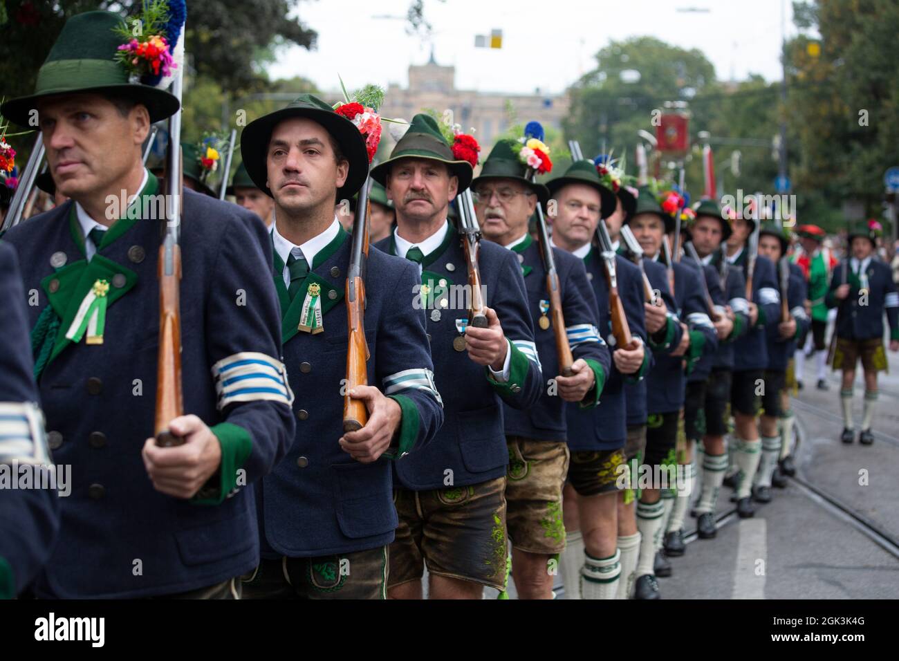 Participants at the Oktoberfest parade in Munich march in traditional ...