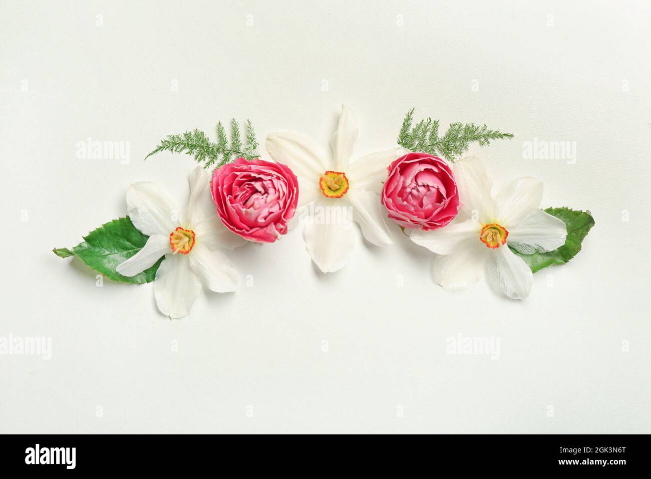 Floral composition of different beautiful flowers and green leaves on ...