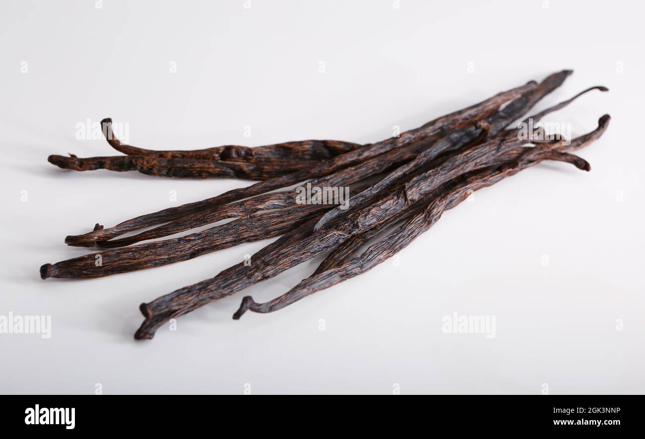 Dried vanilla sticks on white background Stock Photo - Alamy