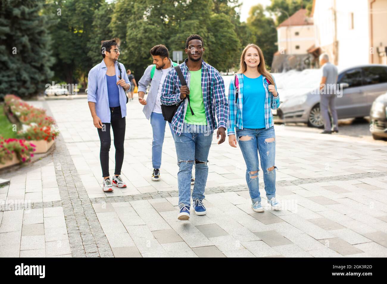 Group of high school students talking and laughing Stock Photo - Alamy