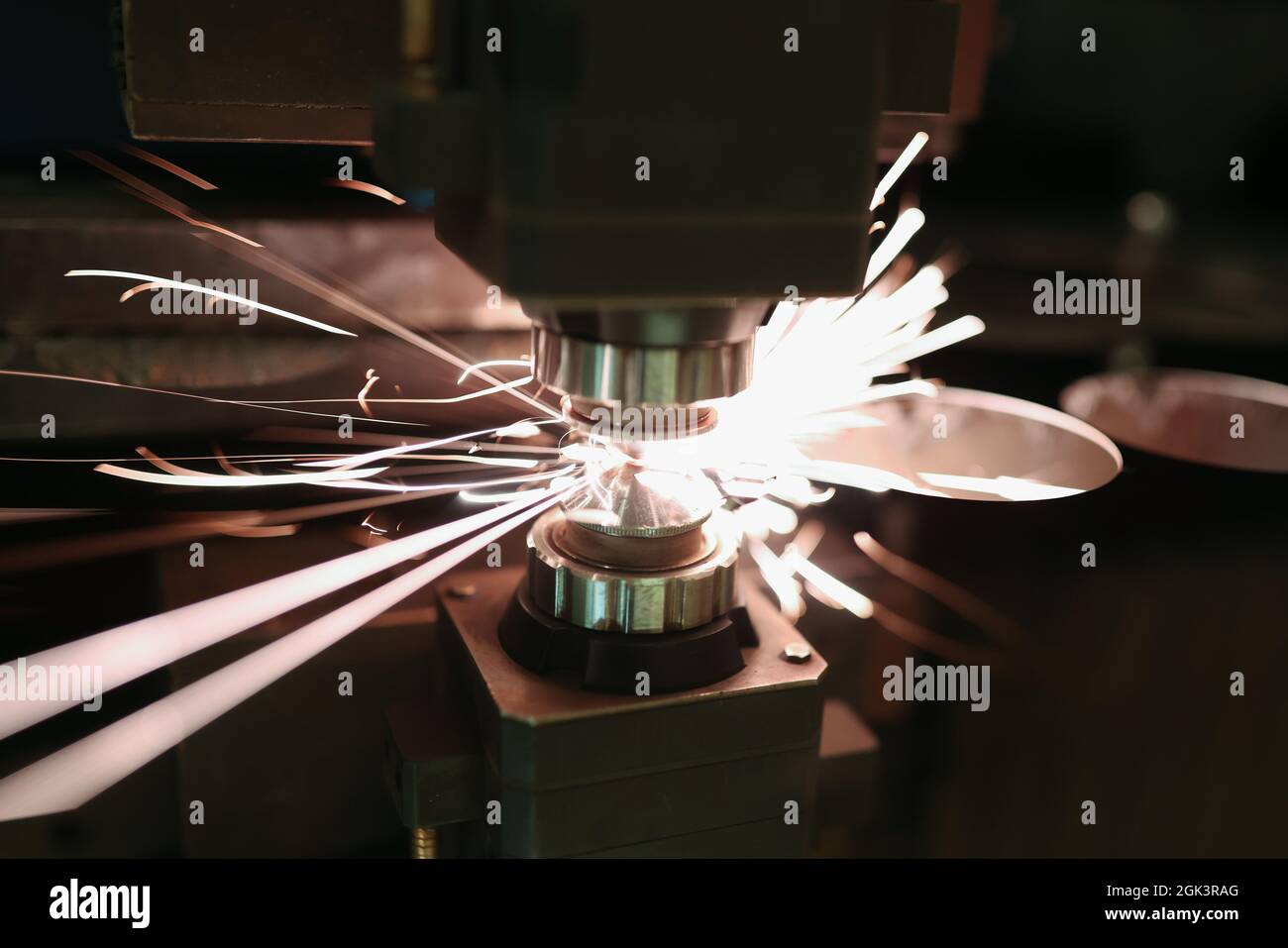 Laser cutting of metal sheet with sparks closeup Stock Photo - Alamy
