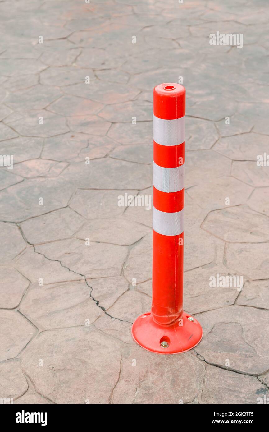 Red and white traffic bollard hi-res stock photography and images - Alamy