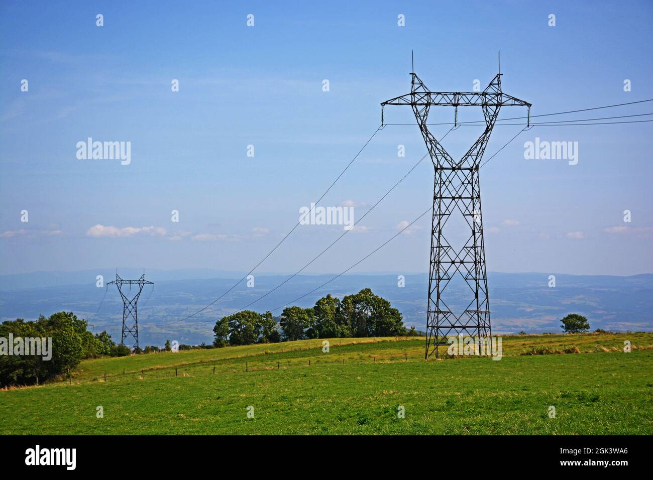 high voltage power lines in countryside, Cezallier, Puy-de-Dome ...