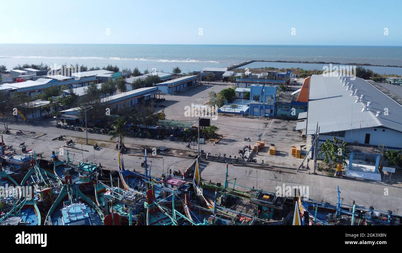 Aerial view of a fish warehouse and fishing boat port Stock Photo - Alamy