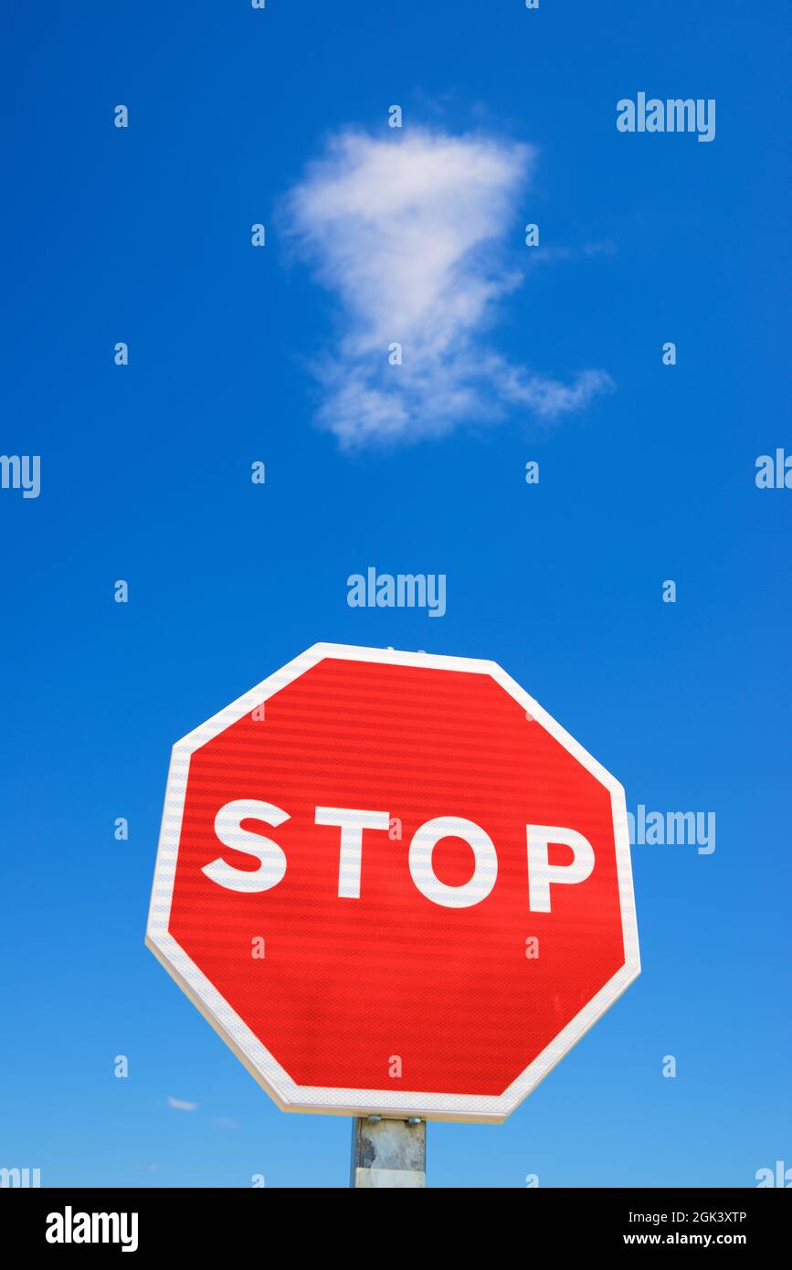 Stop traffic sign with clear blue sky Stock Photo - Alamy