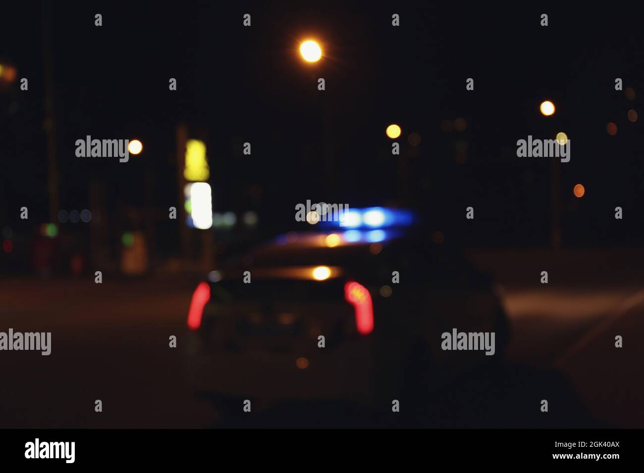 Blurred view of police car on road at night Stock Photo - Alamy