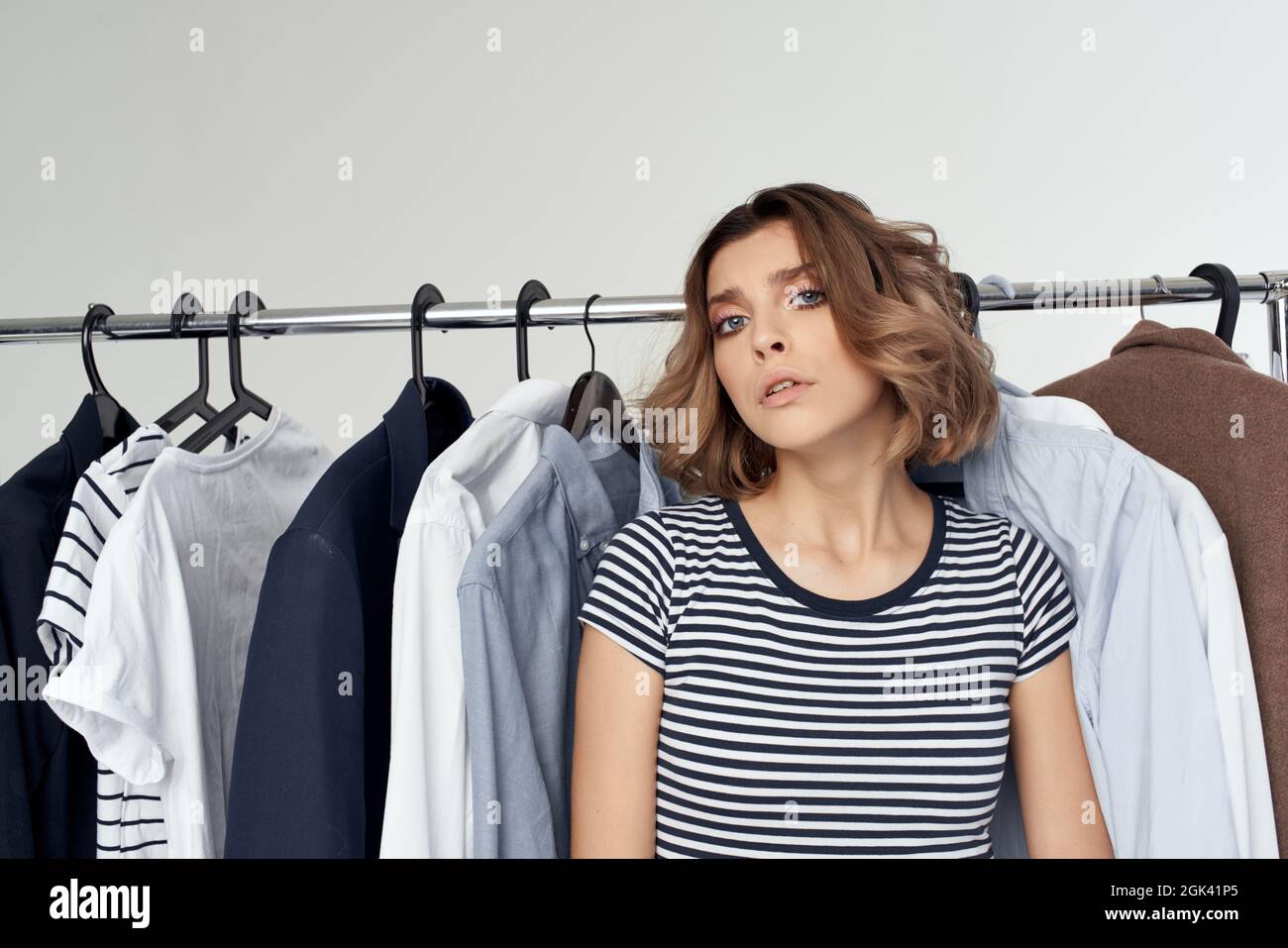 cheerful woman trying on clothes shop retail isolated background Stock ...