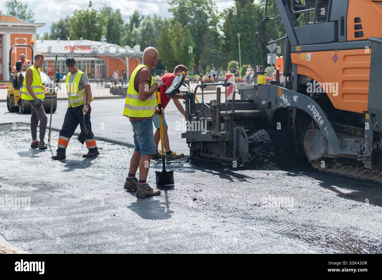 August 4, 2021: Construction site is laying new asphalt road pavement ...