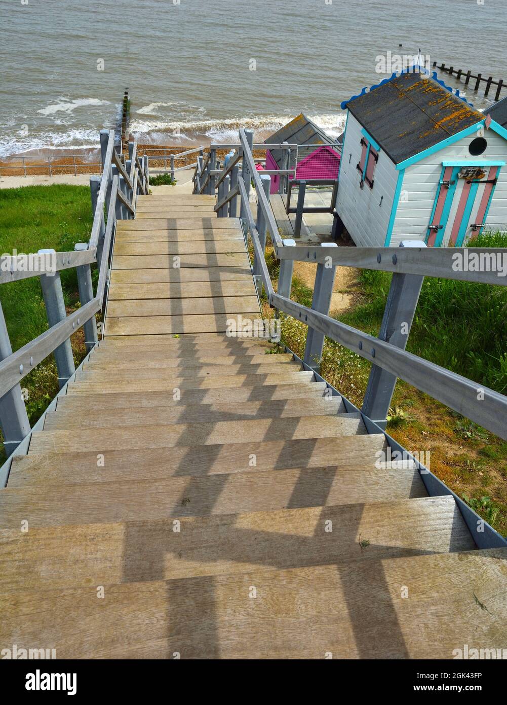Wooden steps leading down to the sea , steps , beach huts, beach and ...