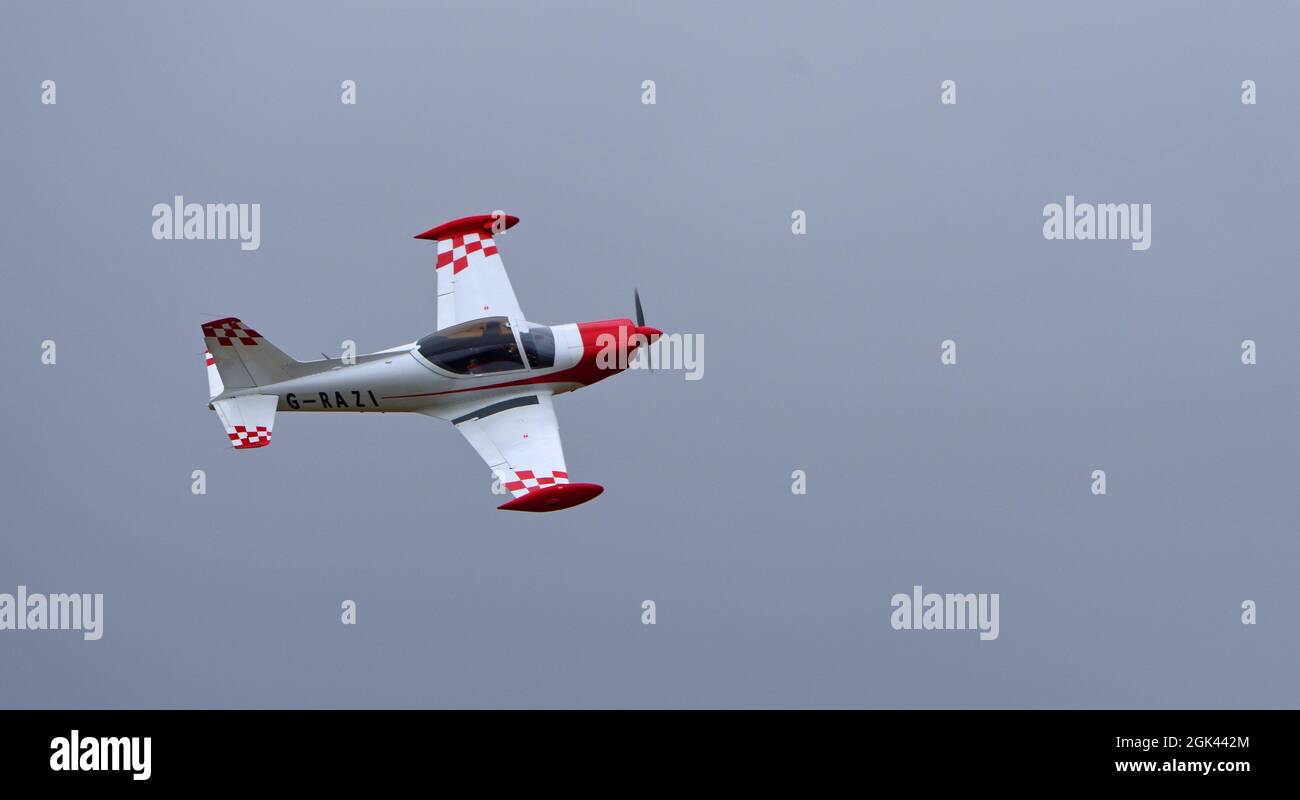 Classic Siai - Marchetti F.260 G-RAZI aircraft in flight with cloudy ...