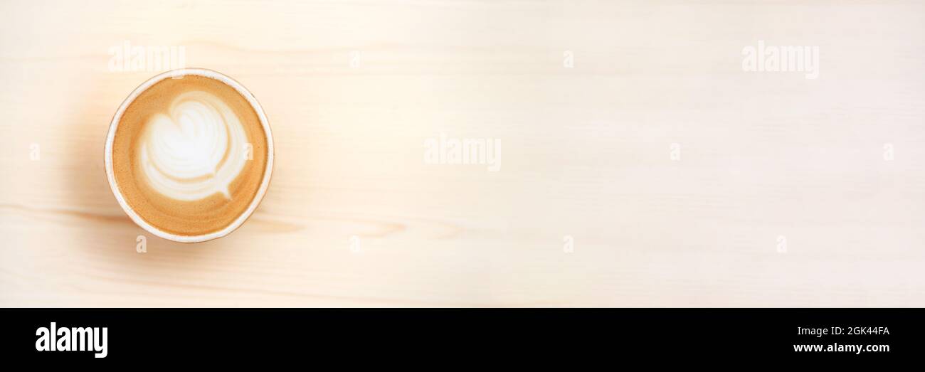 Web banner with cappuccino with frothy foam, coffee cup top view is on ...