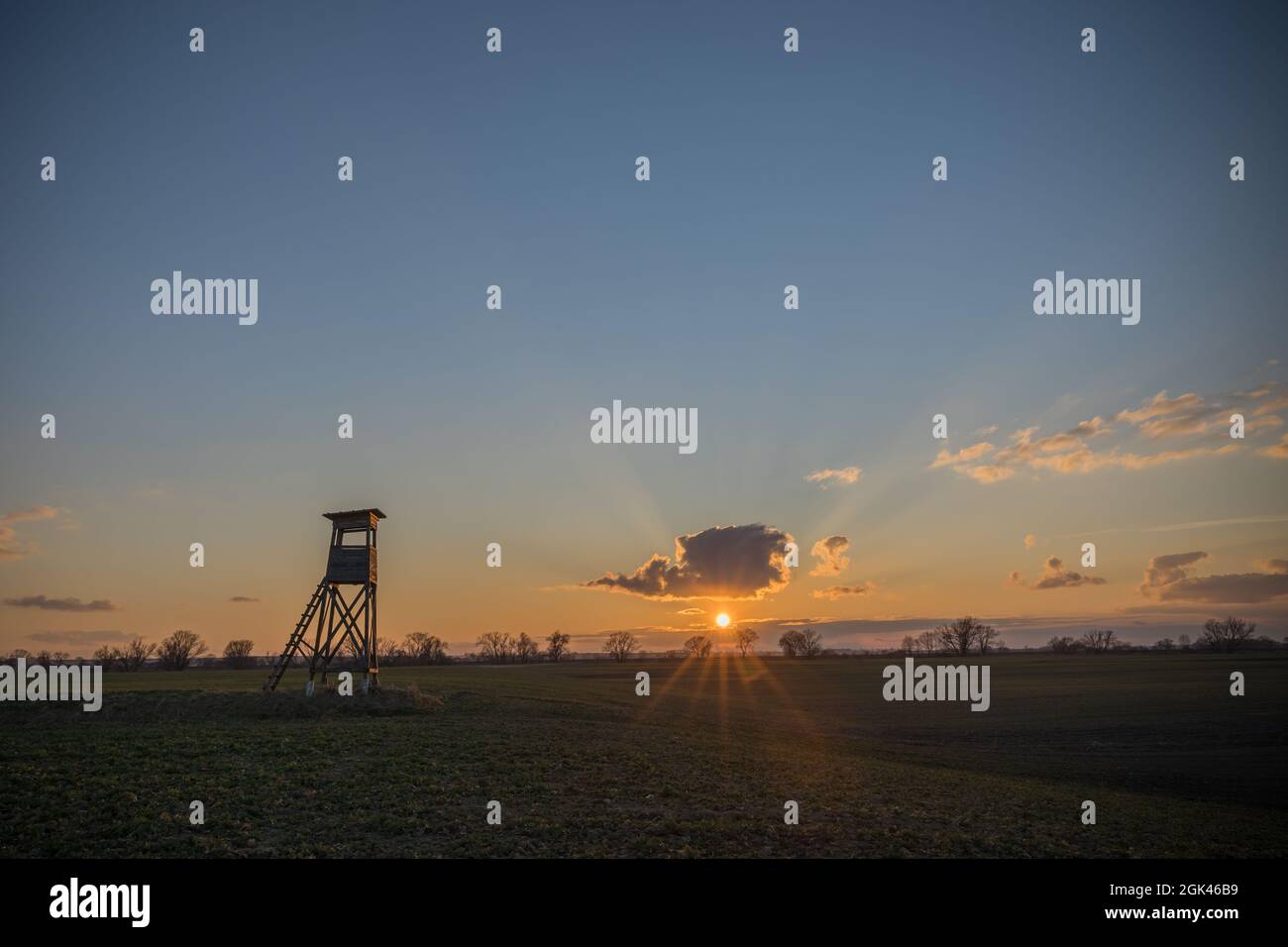 the setting sun, colorful sky, silhouette of a hunting turret Stock ...