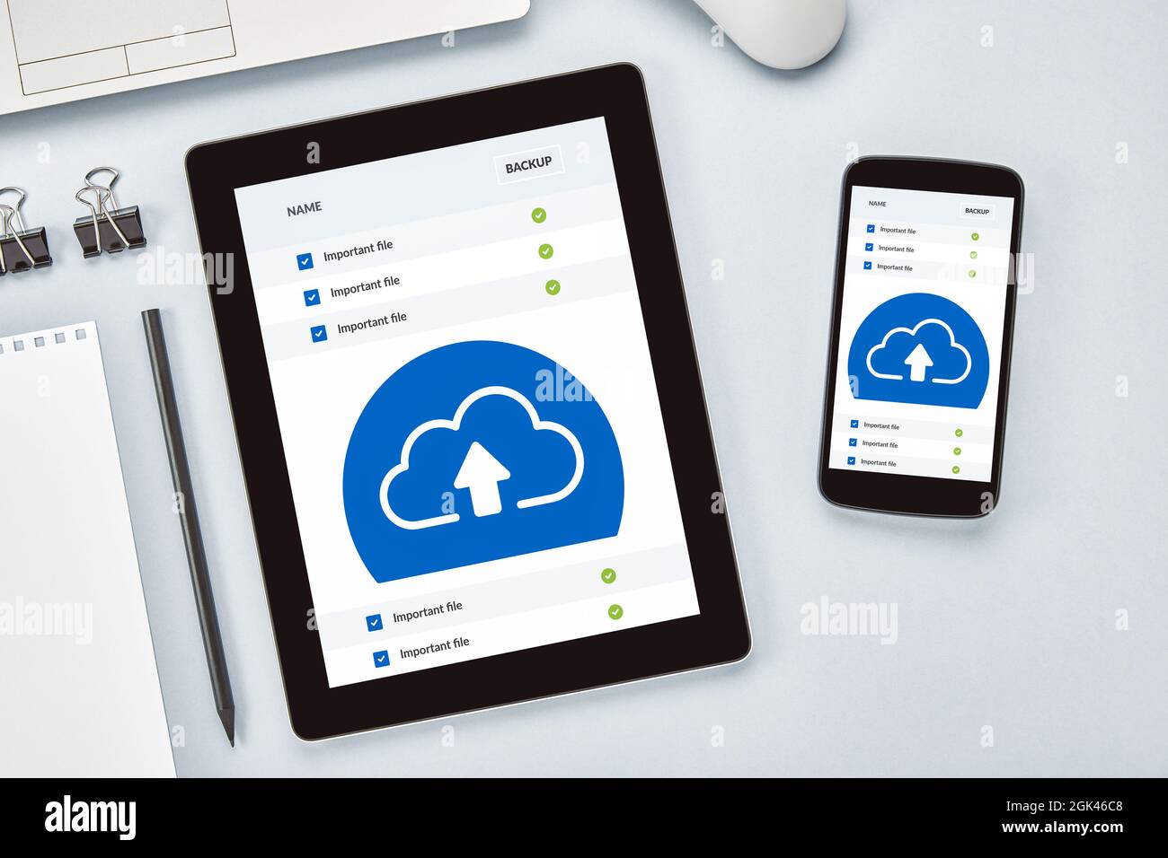 Backup cloud storage concept on smartphone and vertical tablet computer ...