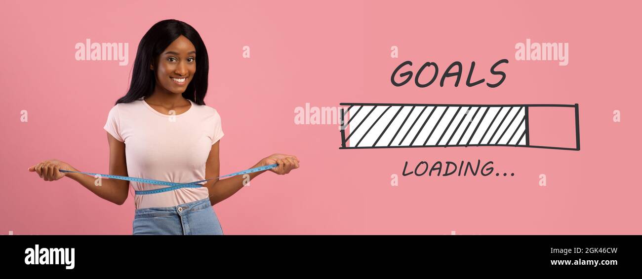 Slim black lady measuring waist, happy with slimming diet results over ...