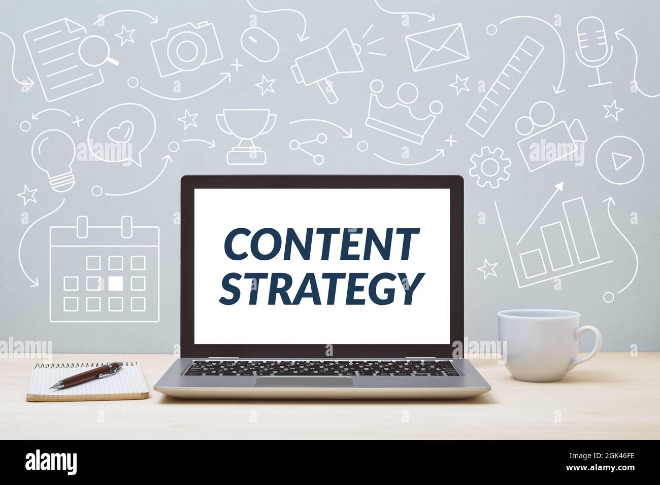 Content strategy text on laptop screen with icon diagram background ...