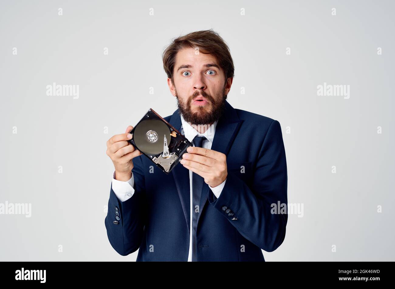 business man in suit hard drive technology information Stock Photo - Alamy