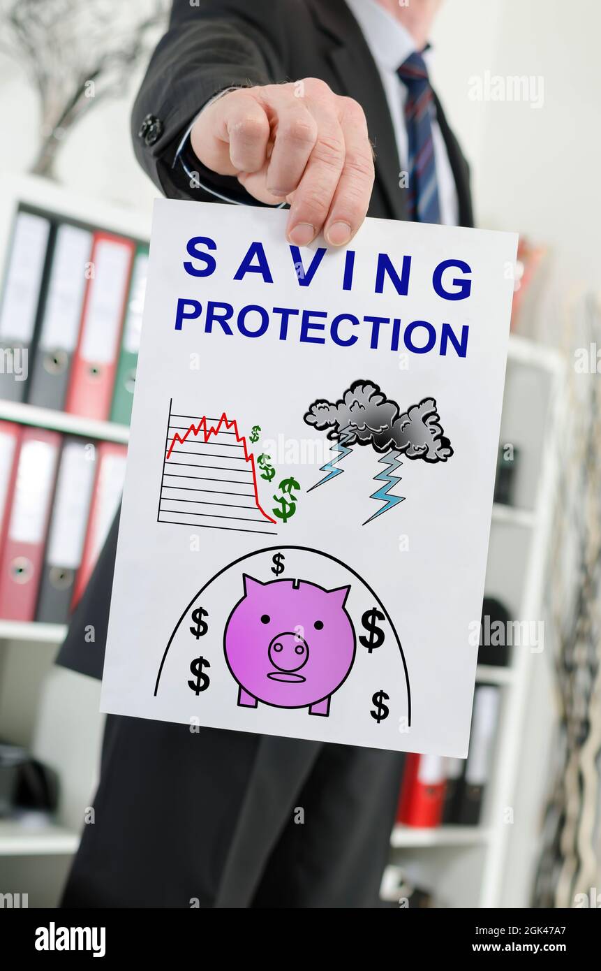 Paper showing saving protection concept held by a businessman Stock ...