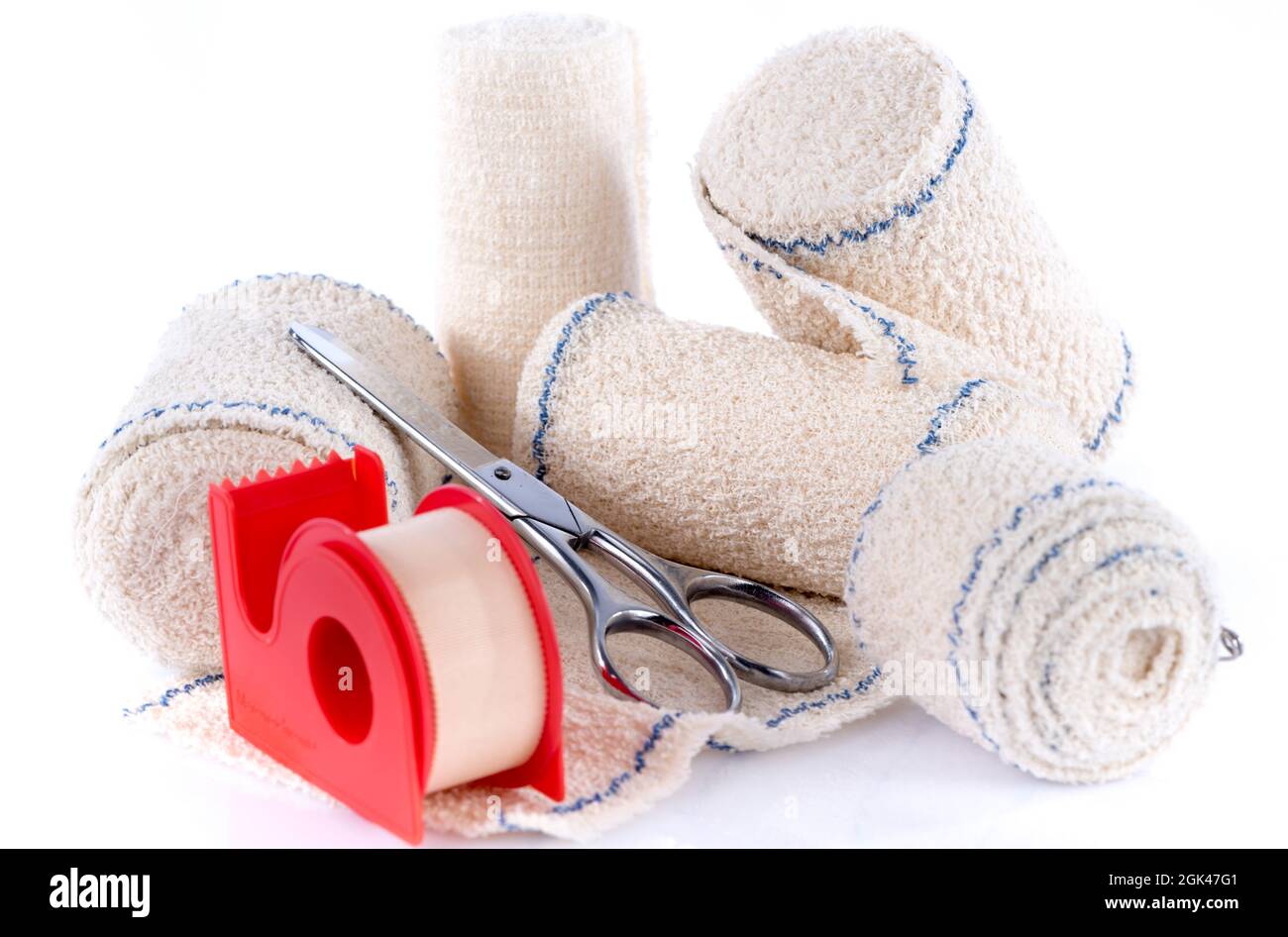 Medical bandages with scissors and sticking plaster, isolated on white ...