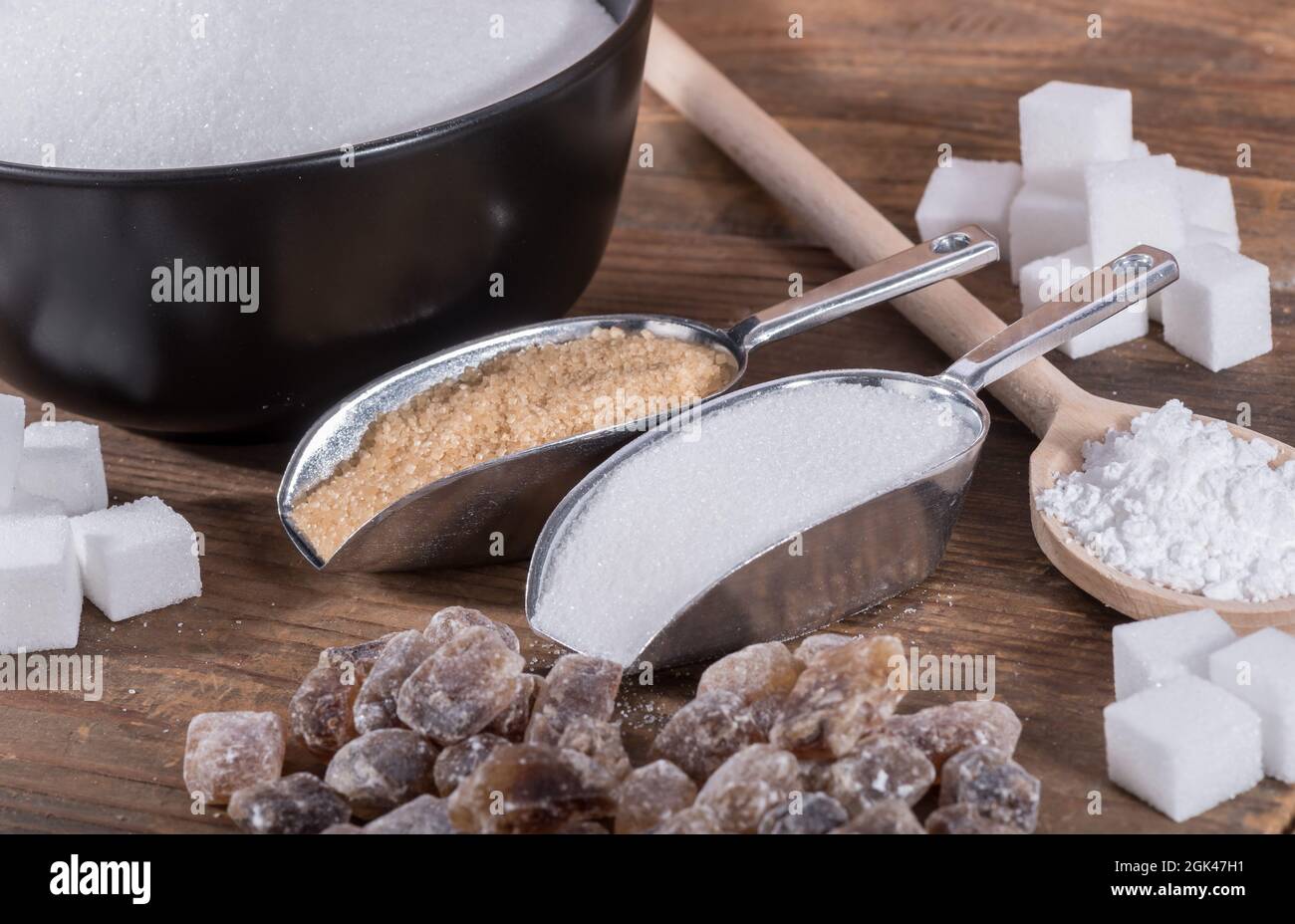 Composition of different types of sugar, on wooden background Stock ...