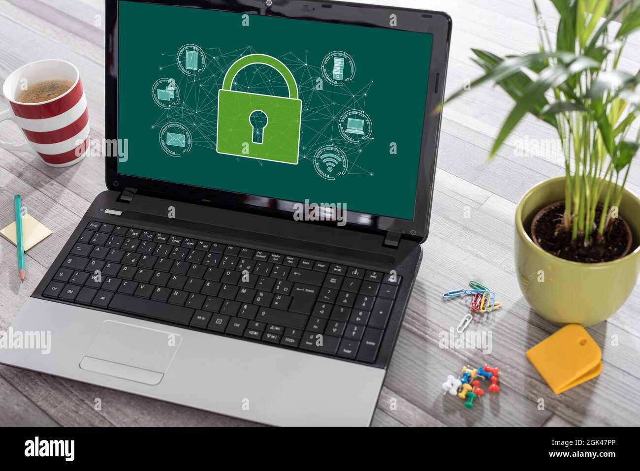 Laptop on a desk with cyber security concept on the screen Stock Photo ...