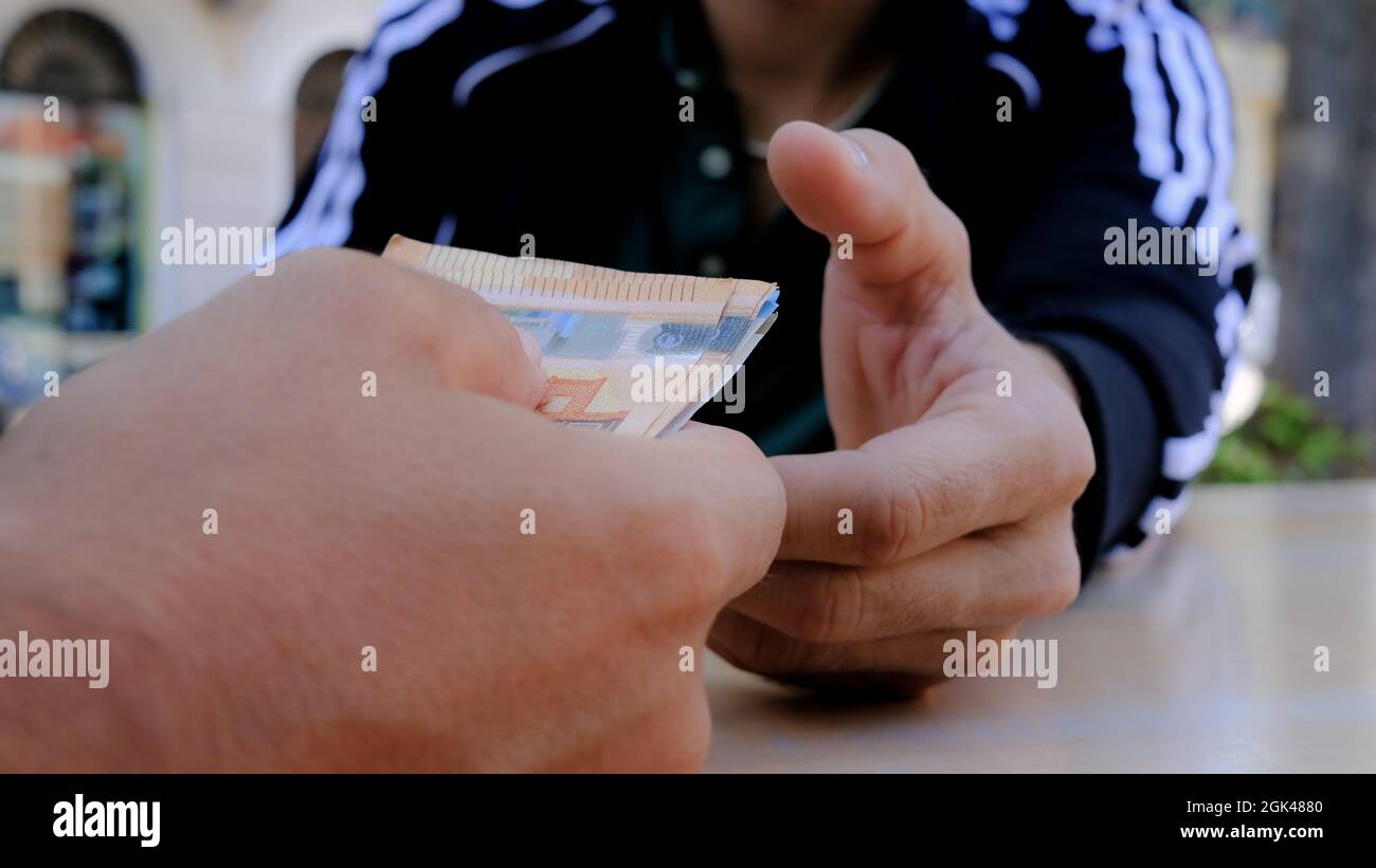 men's hands exchange money, euro banknotes Stock Photo - Alamy