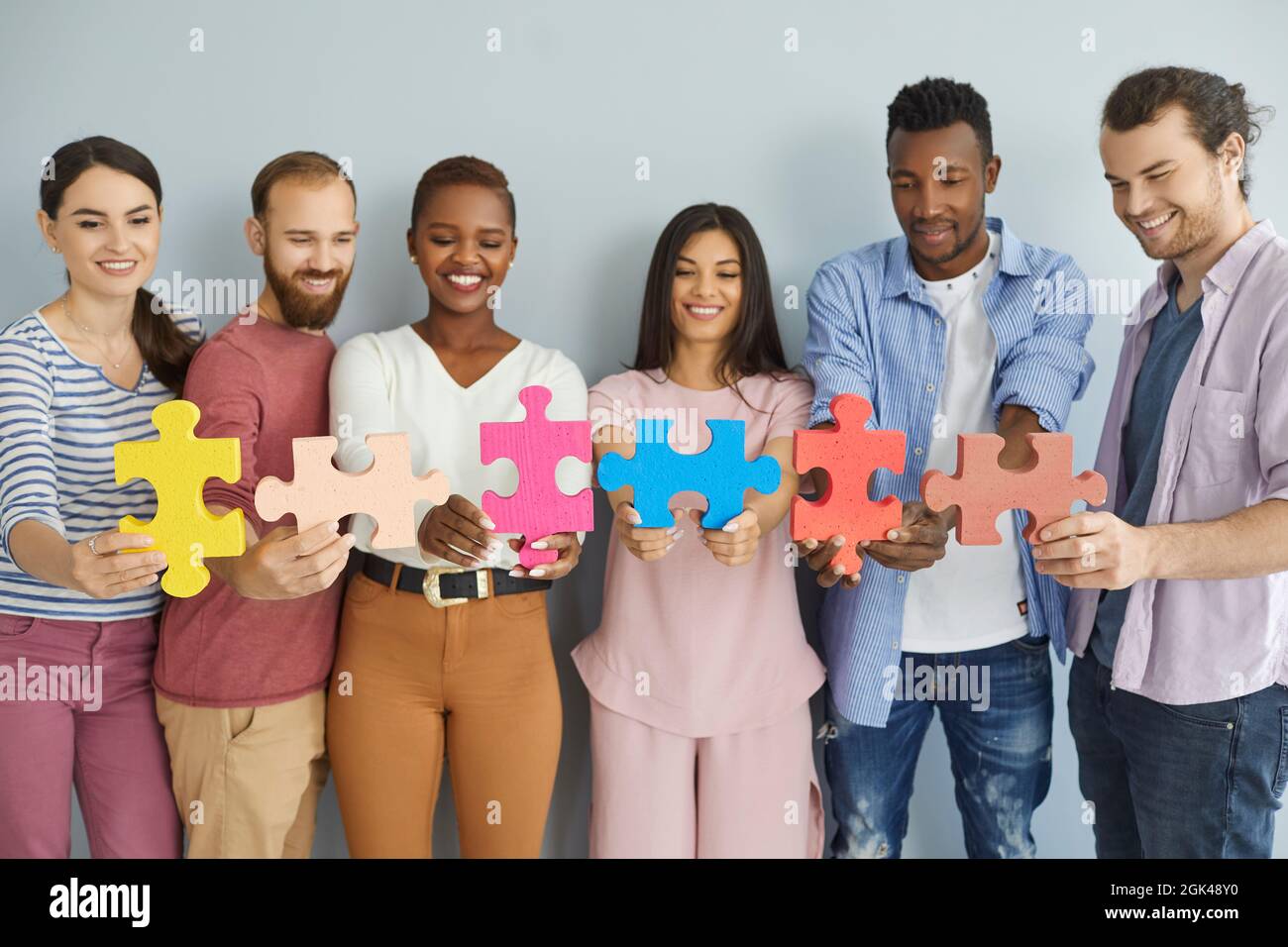 Business people connecting puzzle pieces hi-res stock photography and ...