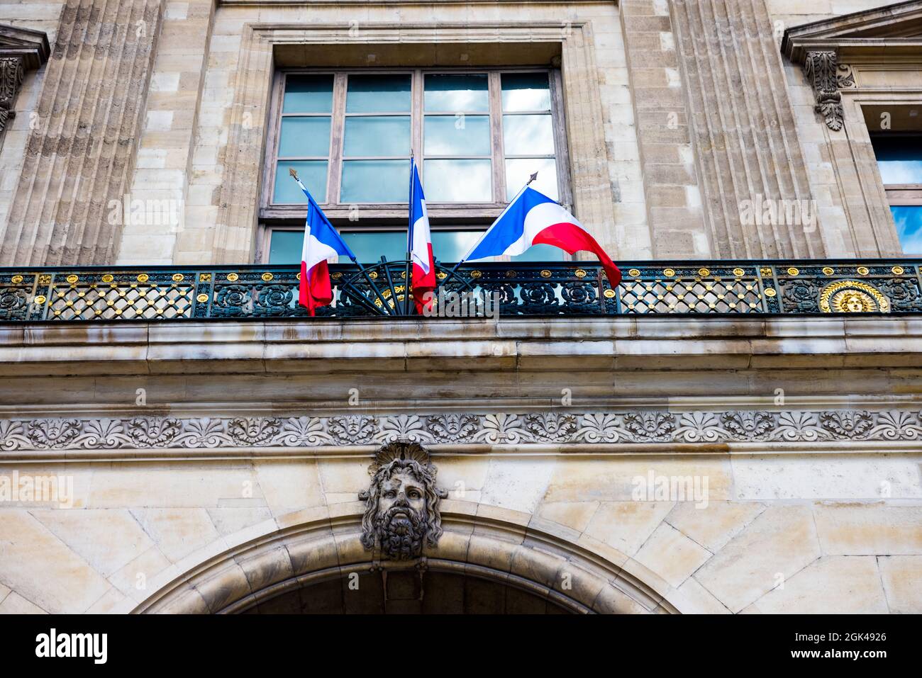 PARIS, FRANCE - Aug 14, 2021: The flags of France on the building of ...