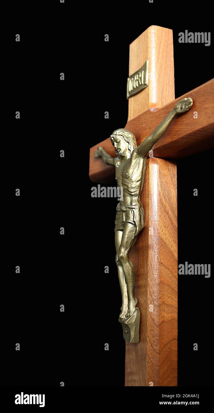 Cross with body of Christ on solid black background Stock Photo - Alamy