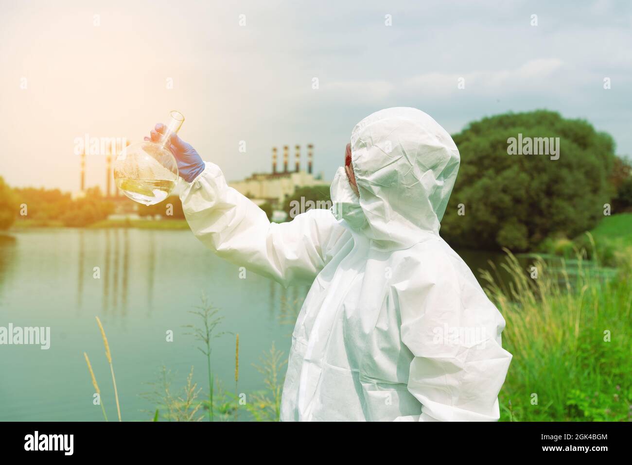 Sampling from open water. A scientist or biologist takes a water sample ...