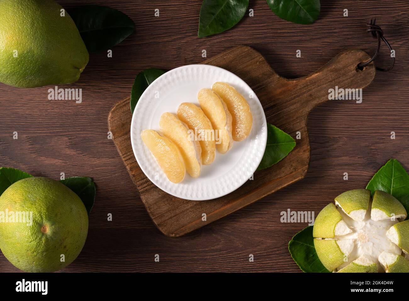 Top view of fresh pomelo on dark wooden table background for Mid-Autumn ...