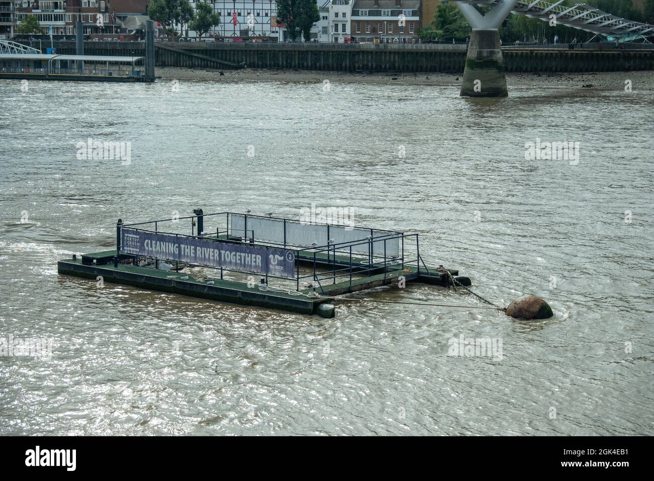 London- July, 2021: Cleaning the Thames, River Thames barge that ...