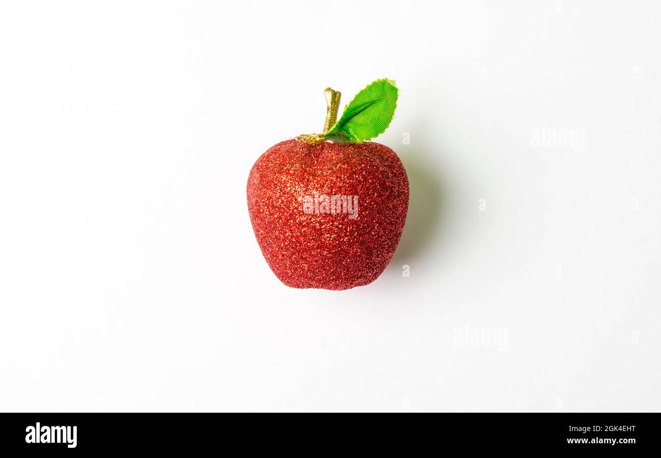 christmas tree decor item. red glitter apple with green leaf, isolated ...