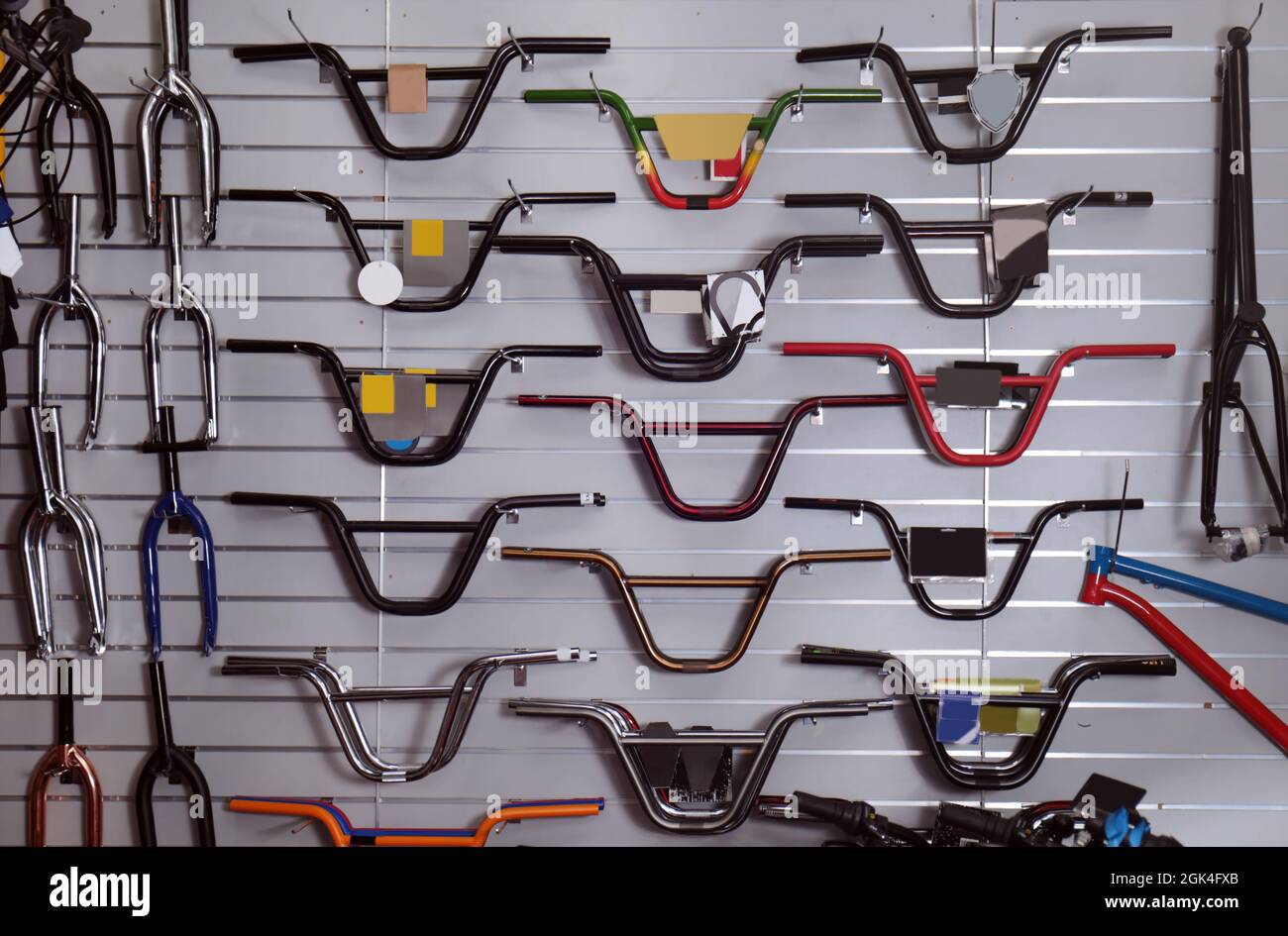 Stand with parts for bicycle in store Stock Photo - Alamy